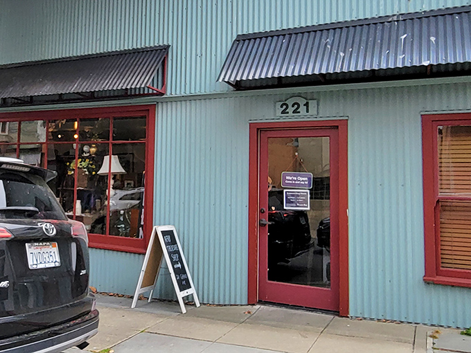 That red door isn't just an entrance—it's a portal to possibility, where thirty bucks can transform your wardrobe, home, and karma all at once.