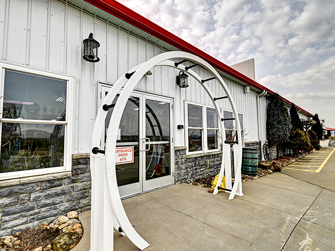The iconic white arched entrance isn't just welcoming—it's practically whispering, "Come on in, the bargains are fine!"