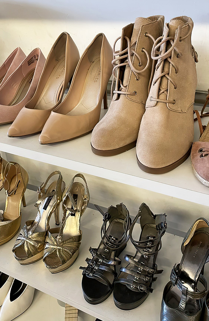 These shelves hold more potential than a library card—designer heels waiting for their Cinderella moment.