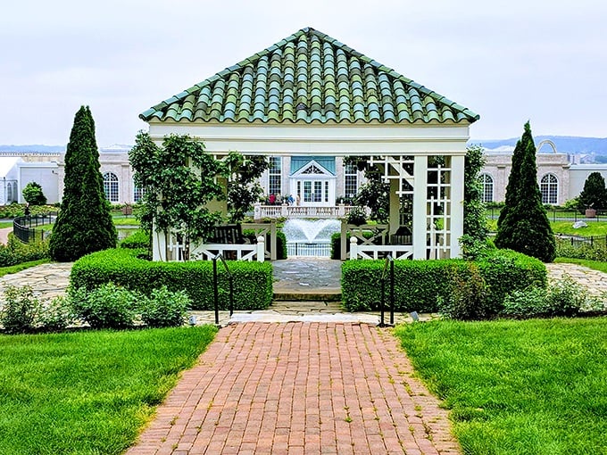 This elegant gazebo isn't just garden architecture—it's where plants go to get married. The green-tiled roof practically winks at you in the sunlight.