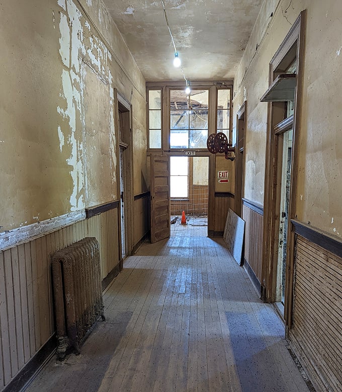 Walking these weathered hallways feels like stepping through a portal to another era. The peeling paint tells stories the tour guides don't.