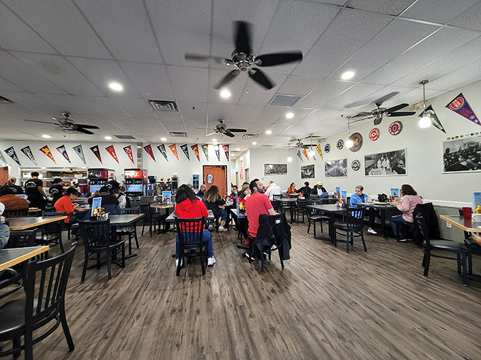Sports pennants line the walls like trophies of comfort food victories. This isn't interior design—it's a declaration that you're among friends.