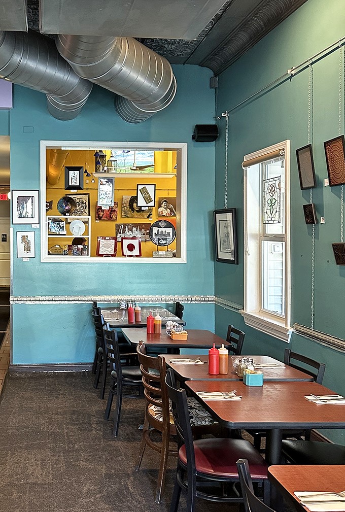 Turquoise walls, exposed ductwork, and local art create the perfect backdrop for breakfast magic. This isn't your grandmother's diner—unless your grandmother was incredibly cool.