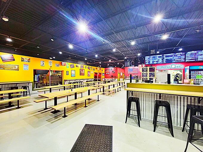 Inside, vibrant yellow and red walls create a lively backdrop for serious eating, while string lights add a touch of warmth to this meat-lover's playground.