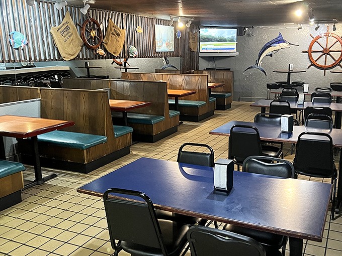 Nautical nostalgia meets no-nonsense dining. The wood-paneled interior with teal accents feels like the galley of a working fishing vessel—one that happens to serve incredible seafood.