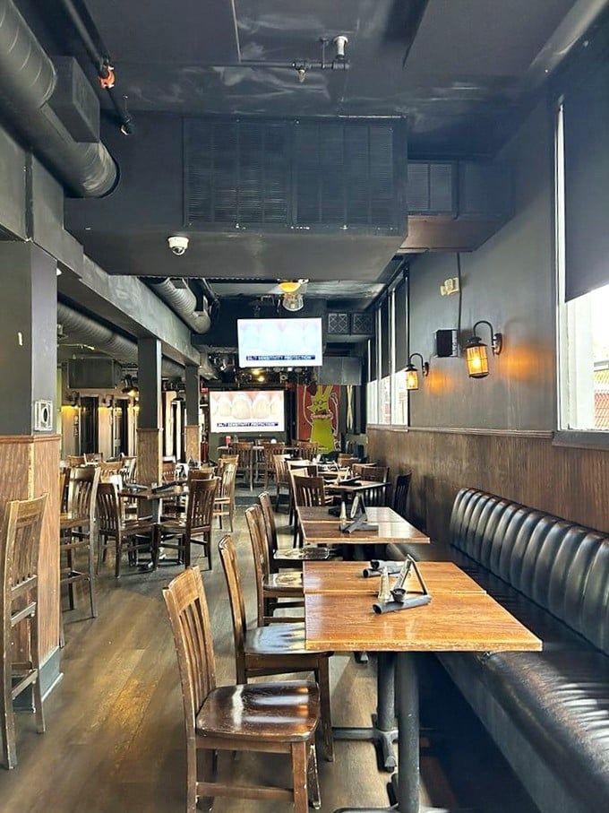 Industrial-chic meets cozy comfort inside Steam Pub, where exposed ductwork and warm wood create the perfect backdrop for serious eating.