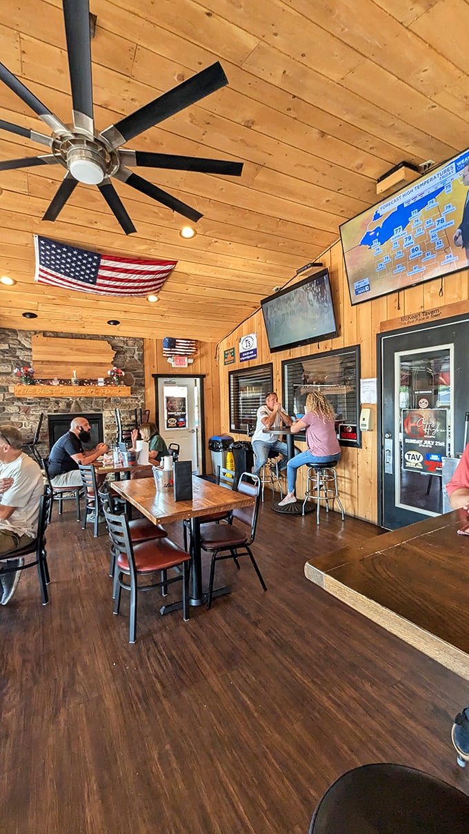 Wooden paneling, American flag, stone fireplace—this isn't interior design, it's a warm Pennsylvania hug. The kind of place where conversations flow as freely as the drinks.