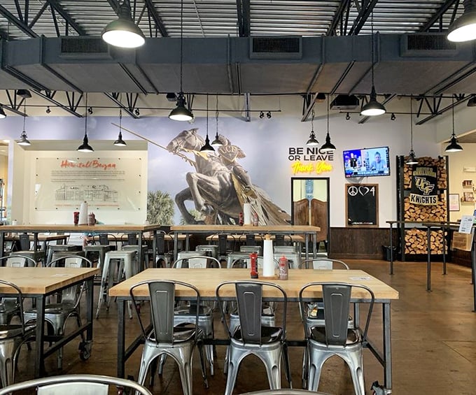 Industrial-chic meets Southern hospitality inside, where the "BE NICE OR LEAVE" sign isn't just decor—it's a philosophy rendered unnecessary by the first bite.
