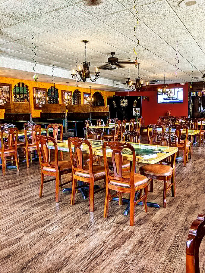 Warm wooden chairs and vibrant walls create that "abuela's dining room" feel, where conversations flow as freely as the salsa.