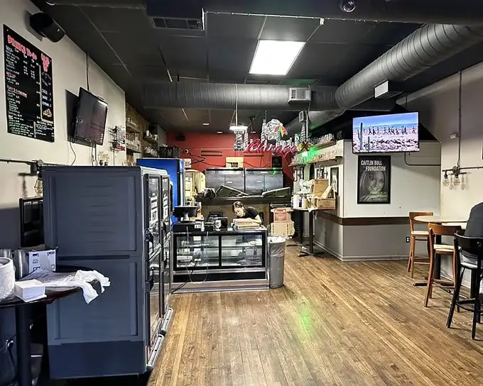 No-frills interior with wooden floors and exposed ductwork – Pequod's knows the real décor should be the pizza on your plate, not hanging on the walls.