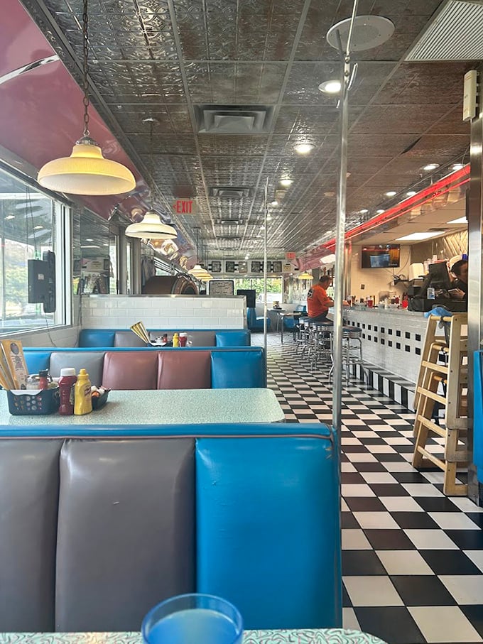 Blue vinyl booths and checkerboard floors—this isn't retro by design, it's authentic by survival. The diner equivalent of rock stars who never changed their sound.