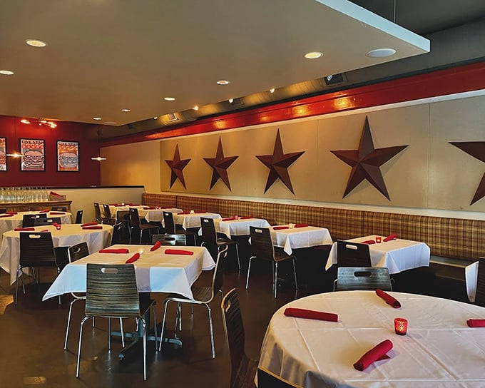 Metal stars line the walls of this cozy dining room, where white tablecloths and red napkins signal this isn't your average fast-food joint.