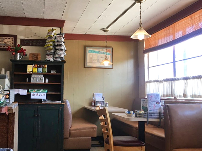 Cozy booths where countless coffee cups have been refilled and life stories exchanged. The wood paneling isn't retro—it's authentically unchanged.