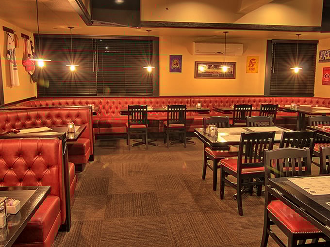 Red leather booths and warm lighting create the perfect backdrop for serious meat consumption. This isn't Instagram-designed ambiance—it's genuine comfort.