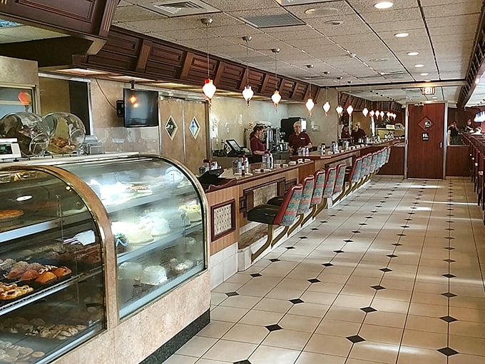 Classic diner counter magic awaits – where spinning stools and pendant lights create the perfect backdrop for life-changing pie conversations.