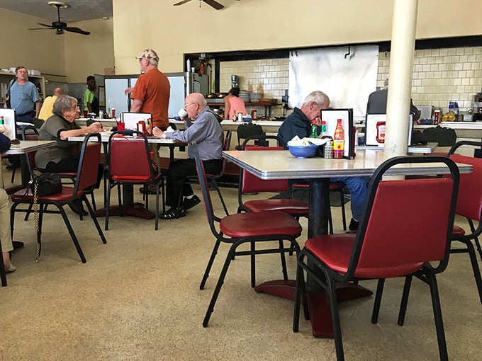 Inside, red vinyl chairs and formica tables create the perfect time capsule where conversations flow as freely as the coffee refills.
