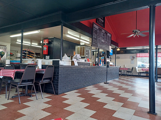 Inside, the classic checkerboard floor and red ceiling create that perfect "I've found somewhere special" atmosphere. No designer needed—just decades of burger wisdom.