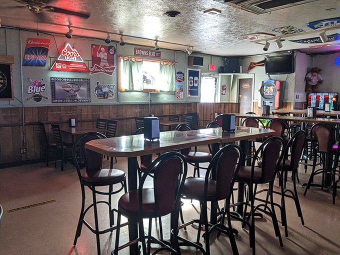 Step inside and you're greeted by the classic wood-paneled warmth of a true neighborhood bar—beer signs glowing like beacons of hospitality against the walls.