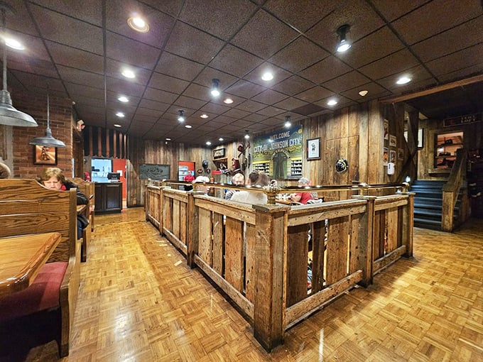 Inside, rustic wood paneling and an open counter create that perfect "come as you are" atmosphere where napkins aren't just provided—they're mandatory.