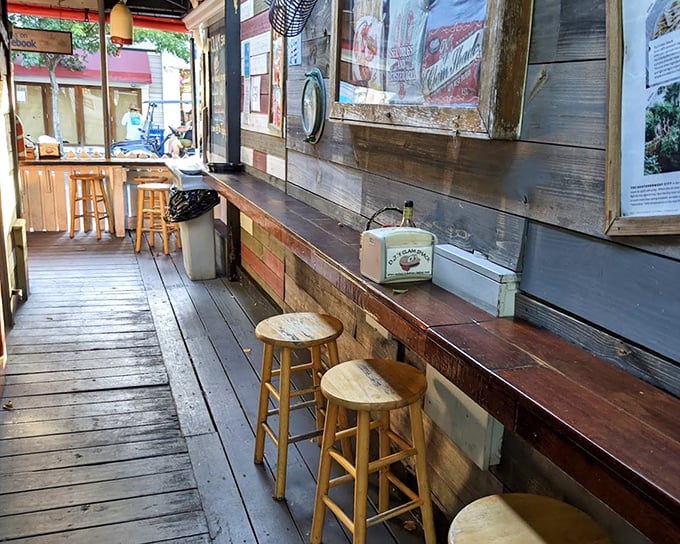 The rustic wooden counter seating offers front-row views to seafood magic in action—simplicity that lets the food be the star.