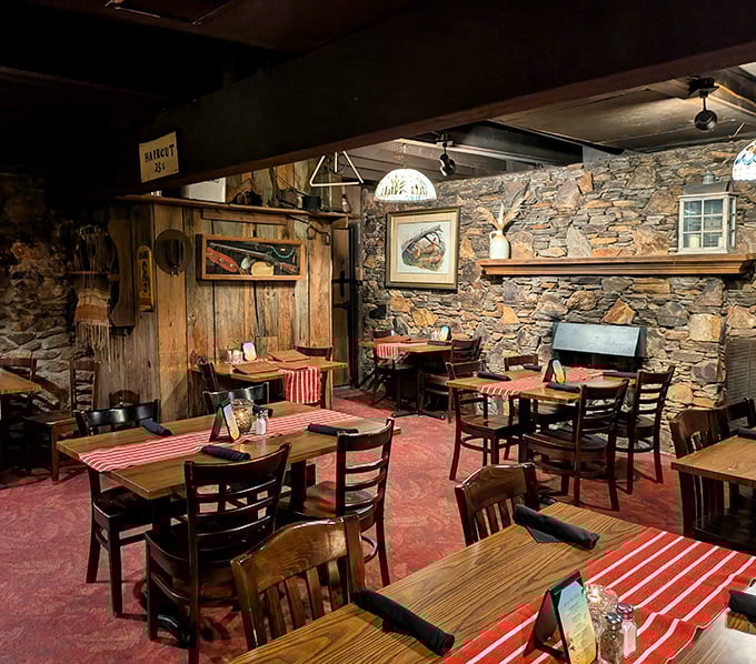 Stone walls and wooden beams create a dining room that feels like a secret hideaway. Those red-checkered tablecloths aren't just decoration—they're a promise.
