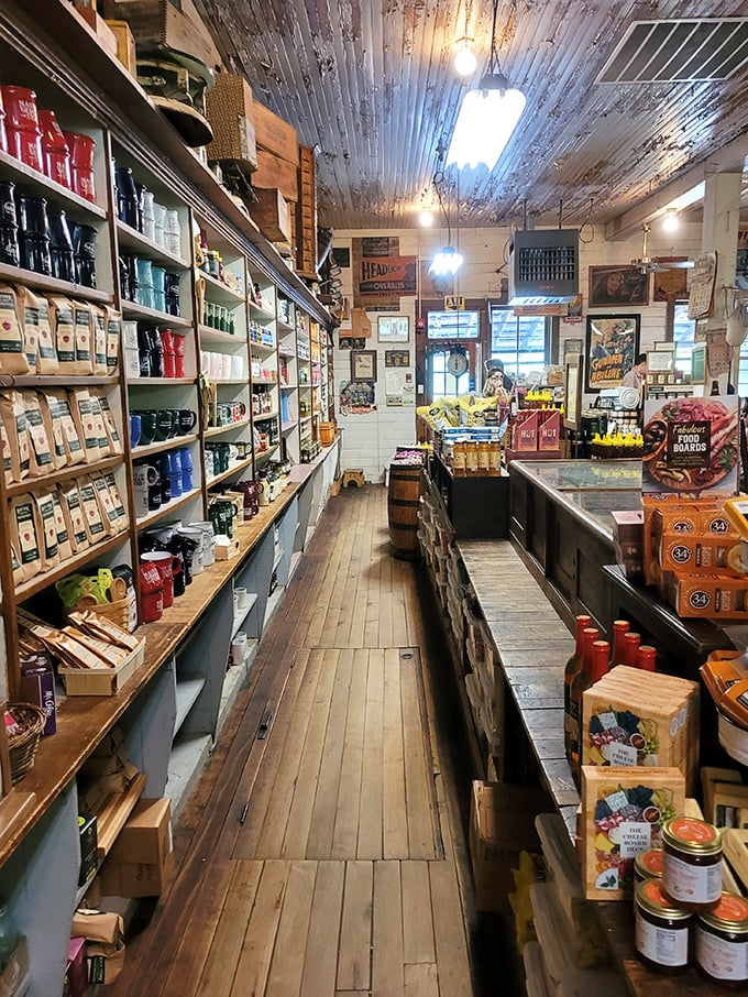 Narrow wooden aisles lined with treasures from floor to ceiling create a magical tunnel effect—like wandering through your grandparents' perfectly organized attic.