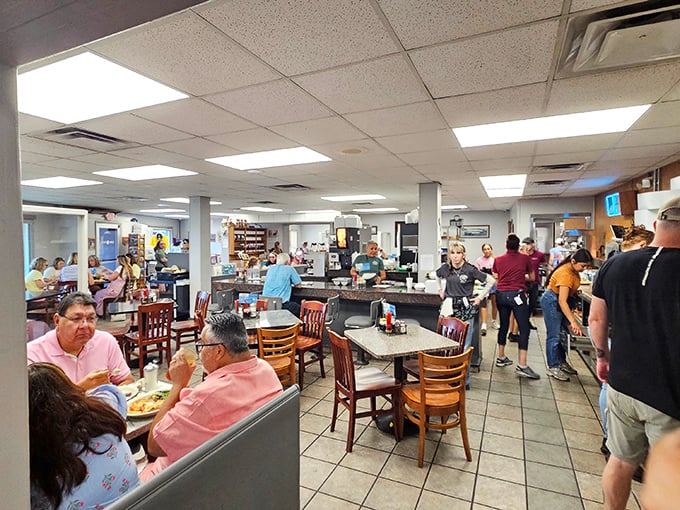 The bustling interior hums with conversation and clinking plates. This isn't just a meal—it's a Texas social club with food.