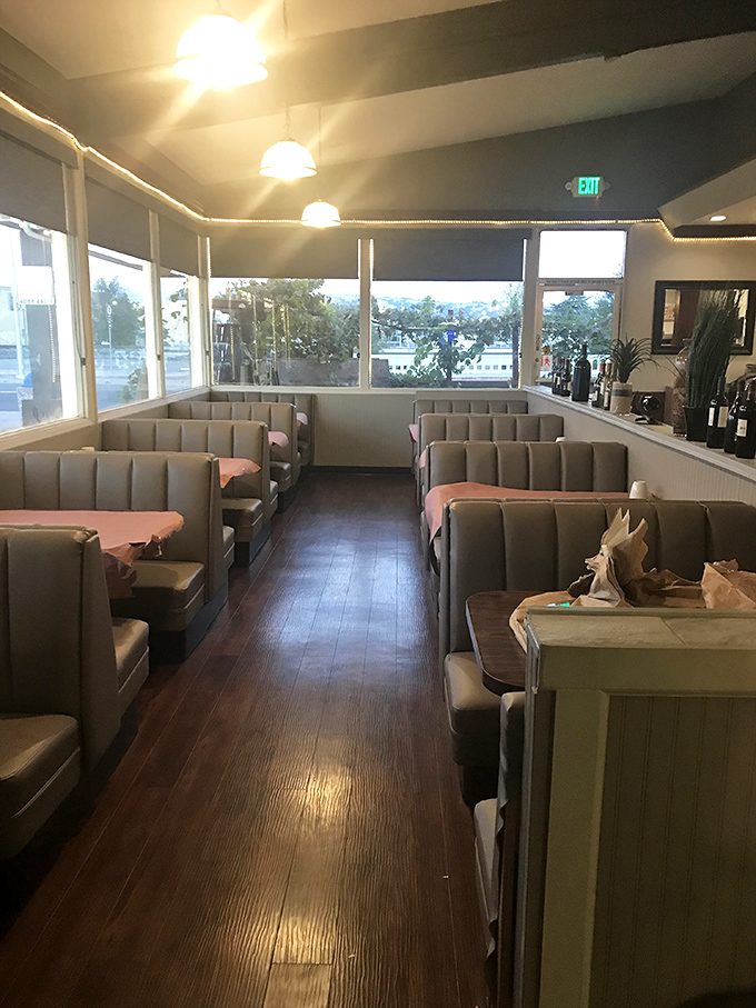 Classic booth seating and warm wood tones create that perfect "everybody knows your name" atmosphere. Comfort begins before the first bite.