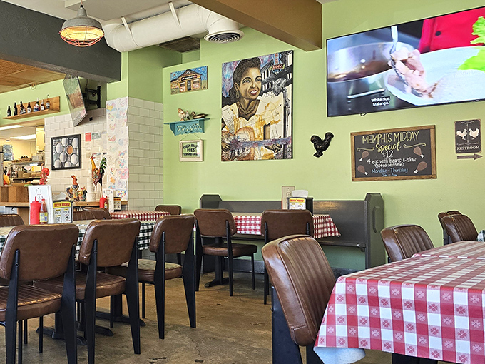 Classic checkered tablecloths and cozy seating create that "you've arrived somewhere special" feeling. The wall art tells stories while you create your own over crispy chicken.