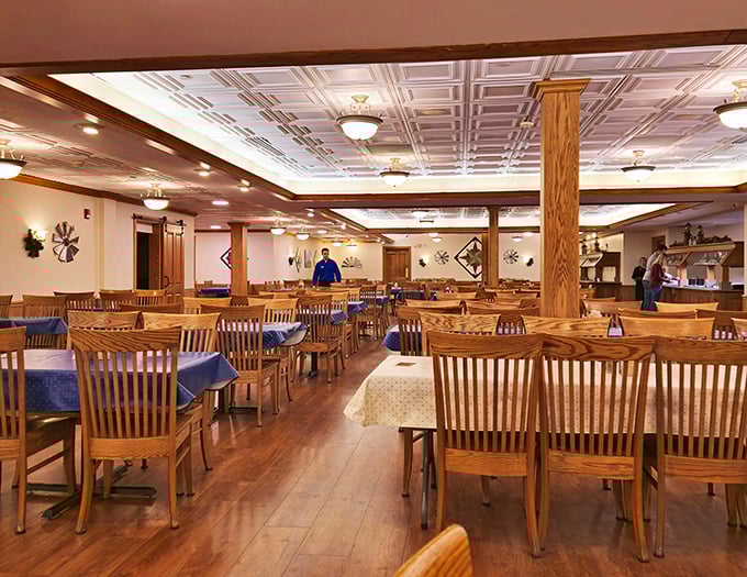 Handcrafted wooden tables and chairs fill a dining room where conversations flow as freely as the gravy – no screens necessary.