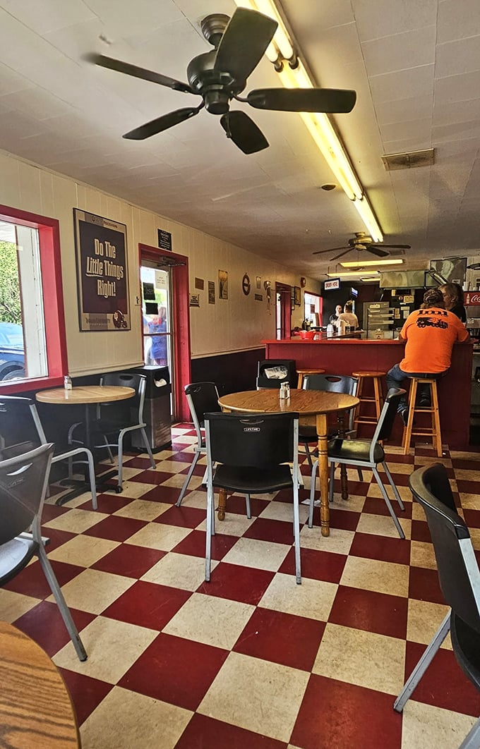 Classic checkered floors and no-nonsense seating tell you everything you need to know—this place prioritizes burger perfection over interior design trends.