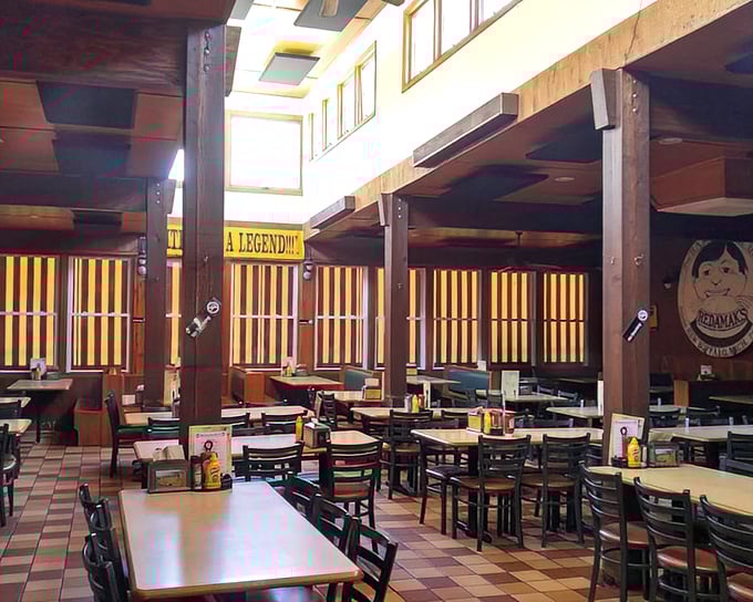 Wood-paneled walls, simple tables, and a banner declaring "A LEGEND..." No arguments here—just hungry anticipation.
