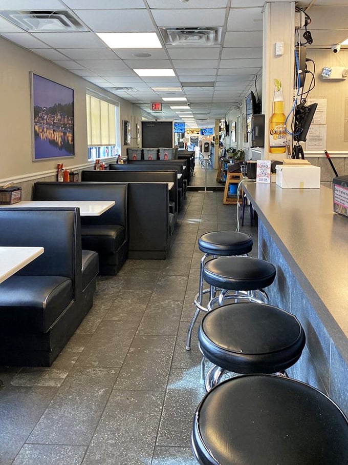 Step inside and time stands still. Black vinyl booths, counter seating, and that unmistakable aroma of sizzling beef – this is Philadelphia's temple of sandwich worship.