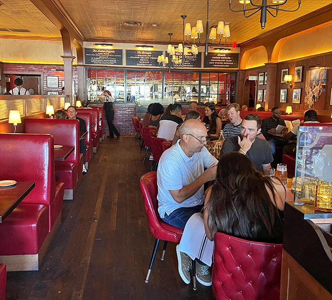 Classic red leather booths and warm wood paneling—the steakhouse equivalent of a bear hug from your favorite uncle.