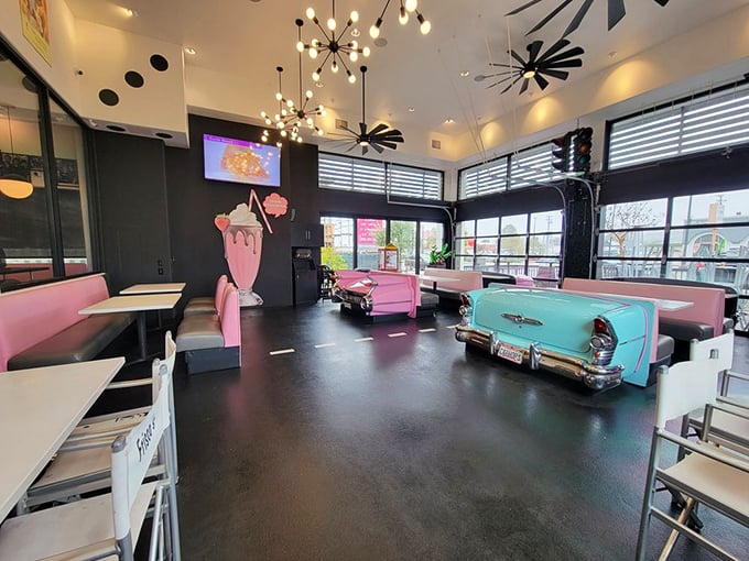 Step inside and time-travel to the 1950s, where car-shaped booths and starburst lighting fixtures make calories count twice – once for taste, once for nostalgia.