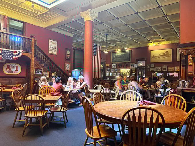 History hangs in the air alongside the American flag in this dining room where Windsor chairs and tin ceilings transport you to territorial Arizona.