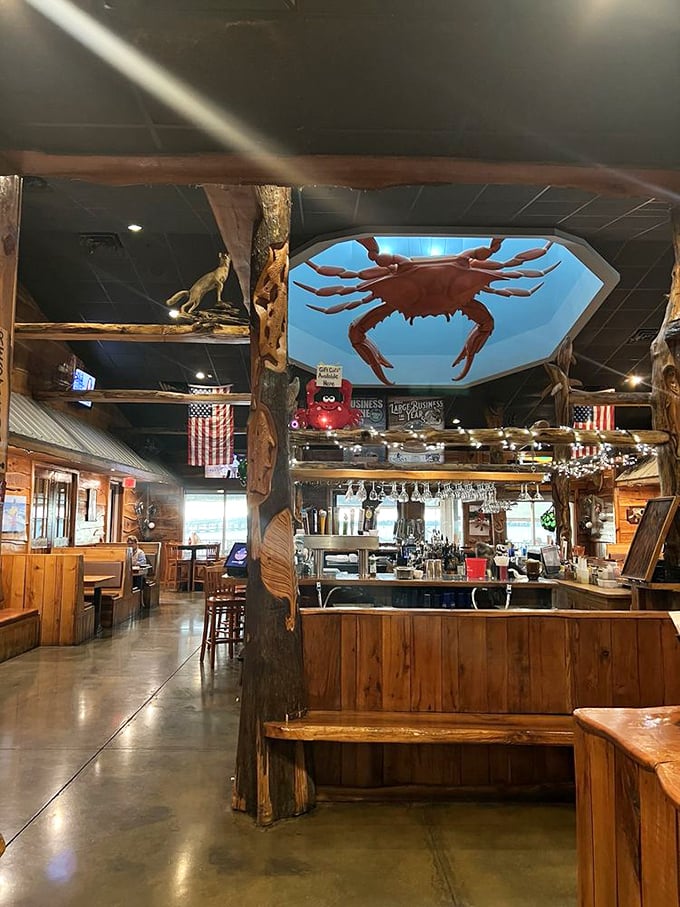 That giant red crab watching over the bar isn't judging your drink order—it's just making sure you're having a good time in this rustic maritime haven.