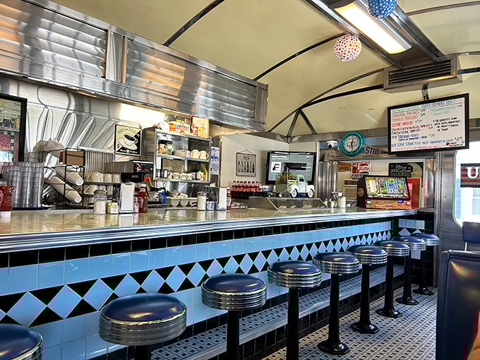 Blue and black diamond patterns, chrome stools, and that unmistakable counter—this isn't retro design, it's the real deal that never went out of style.