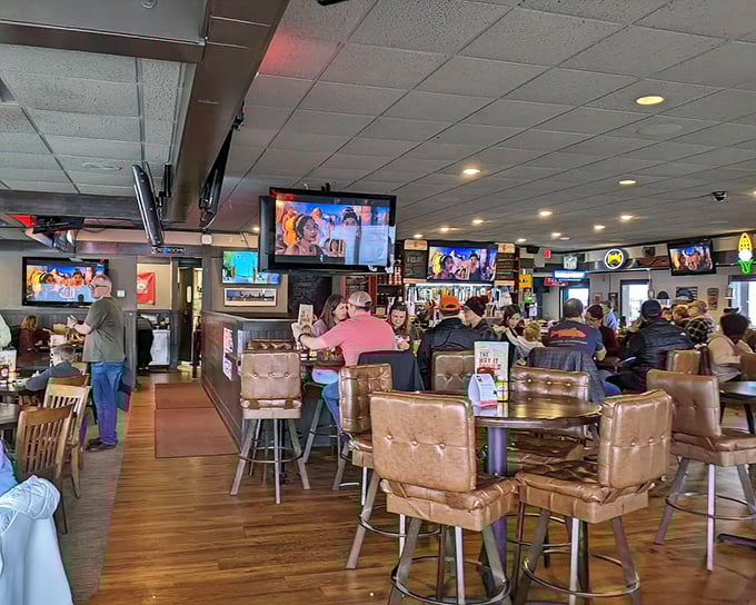 The bustling interior hums with the sound of happy diners. Those leather chairs aren't just comfortable—they're strategic traps to keep you ordering "just one more round."