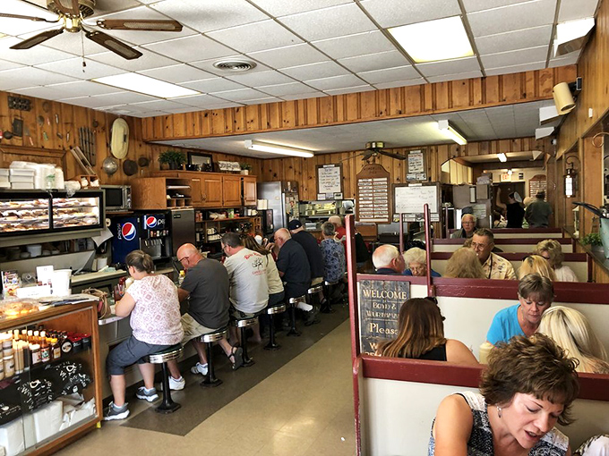 Inside, wood-paneled walls and counter seating create the perfect stage for breakfast theater—where regulars and tourists share equal billing in the daily performance.