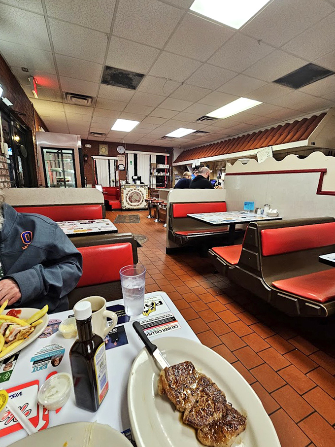 Classic red vinyl booths and terra cotta floors tell you everything you need to know—this place has been perfecting comfort food while trends come and go.