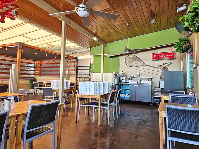 Wooden ceiling beams and green accent walls create the perfect backdrop for the breakfast drama about to unfold on your plate.