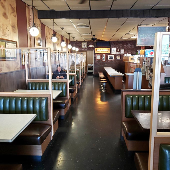 Classic green vinyl booths and no-nonsense counter seating create the perfect backdrop for comfort food conversations. This isn't trendy dining—it's timeless.
