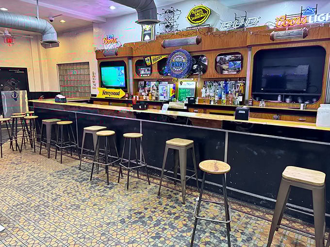 Classic Pittsburgh bar ambiance with no pretension—just wooden stools, vintage tile floors, and the promise of honest food that's kept regulars coming back for decades.