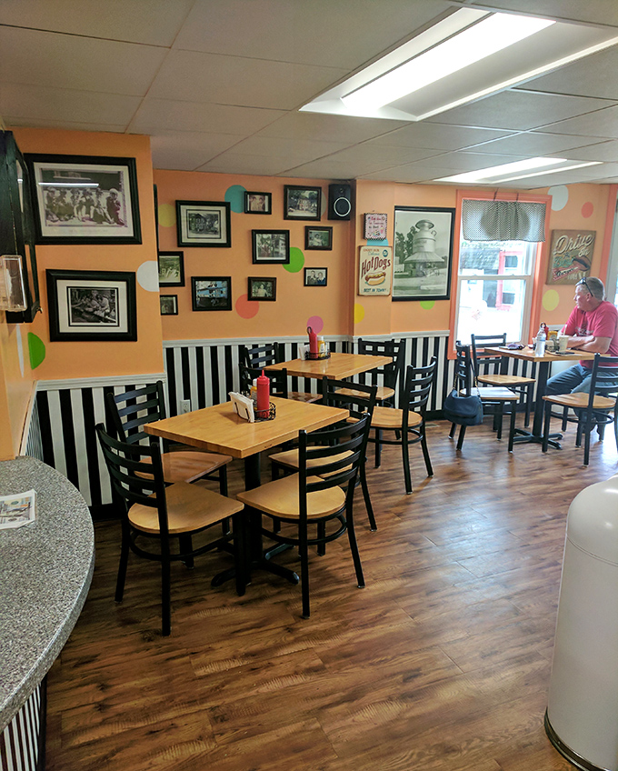 Orange walls, black-and-white stripes, and photos that tell stories—this dining room feels like Wisconsin's answer to the Cheers bar.