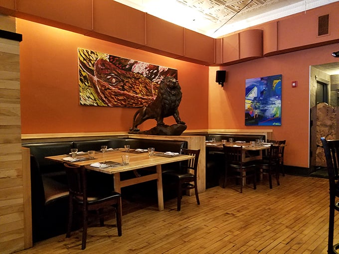 Modern art meets historic architecture in Dante's dining room. That lion sculpture isn't judging your pasta choice—but maybe order what he's having.