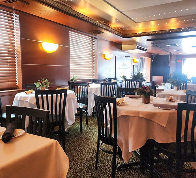 White tablecloths and leopard print carpet create that perfect "fancy but fun" vibe—like wearing pearls with your favorite jeans.