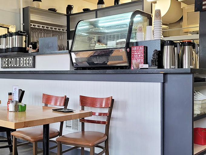Counter seating offers front-row tickets to the breakfast show, where coffee thermoses stand at attention, ready for morning duty.
