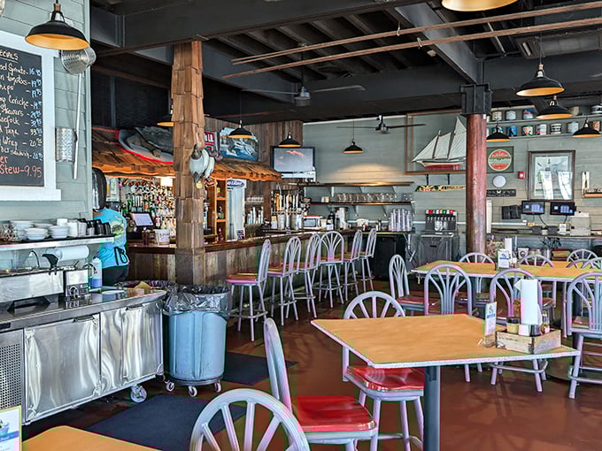 Nautical charm meets comfort in this dining room where wooden beams and maritime décor tell you you're in the right place for seafood magic.