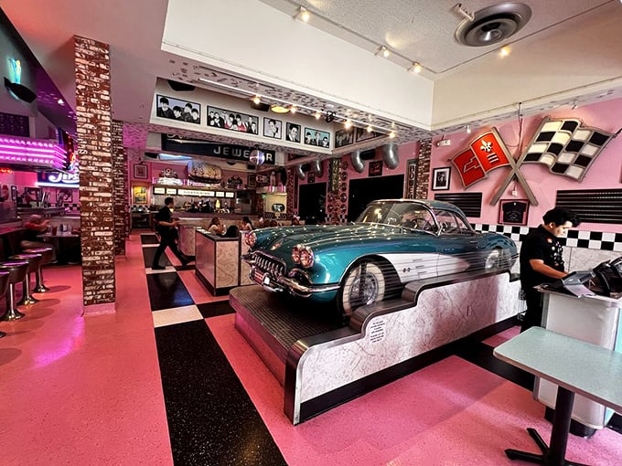 Where classic cars meet classic rock—this turquoise Corvette isn't just decoration, it's the unofficial maitre d' of this chrome-plated wonderland.